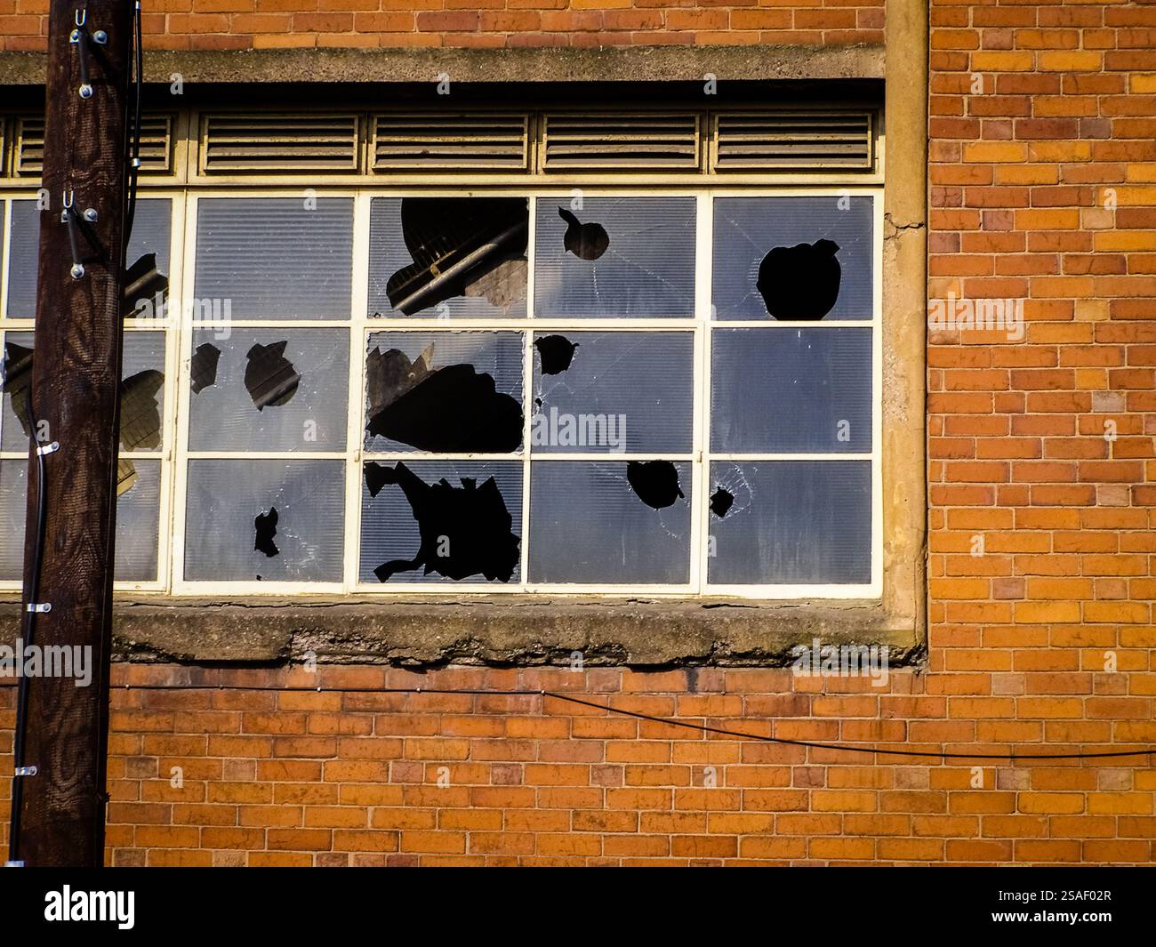 shattered glass window in old factory building Stock Photo - Alamy