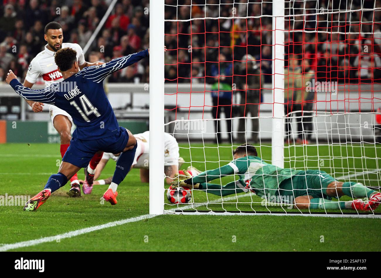 Stuttgart goalkeeper Fabian Bredlow, right, clears the ball from PSG's ...