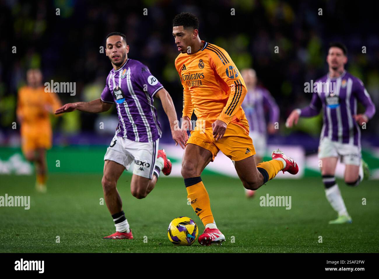 Jude Bellingham of Real Madrid CF duels for the ball with Anuar Tuhami ...