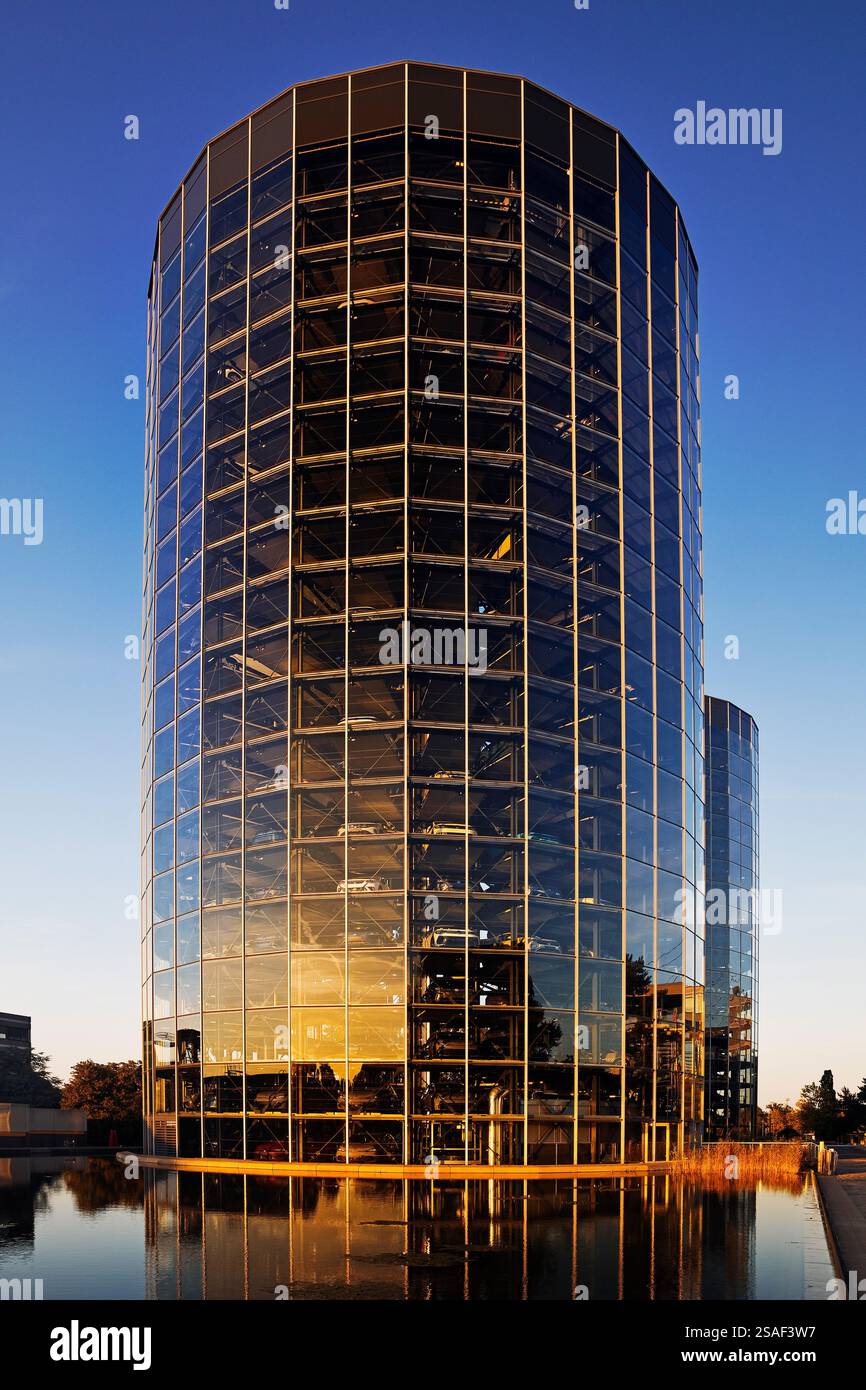 glass car silo with new cars in the evening, Germany, Lower Saxony ...