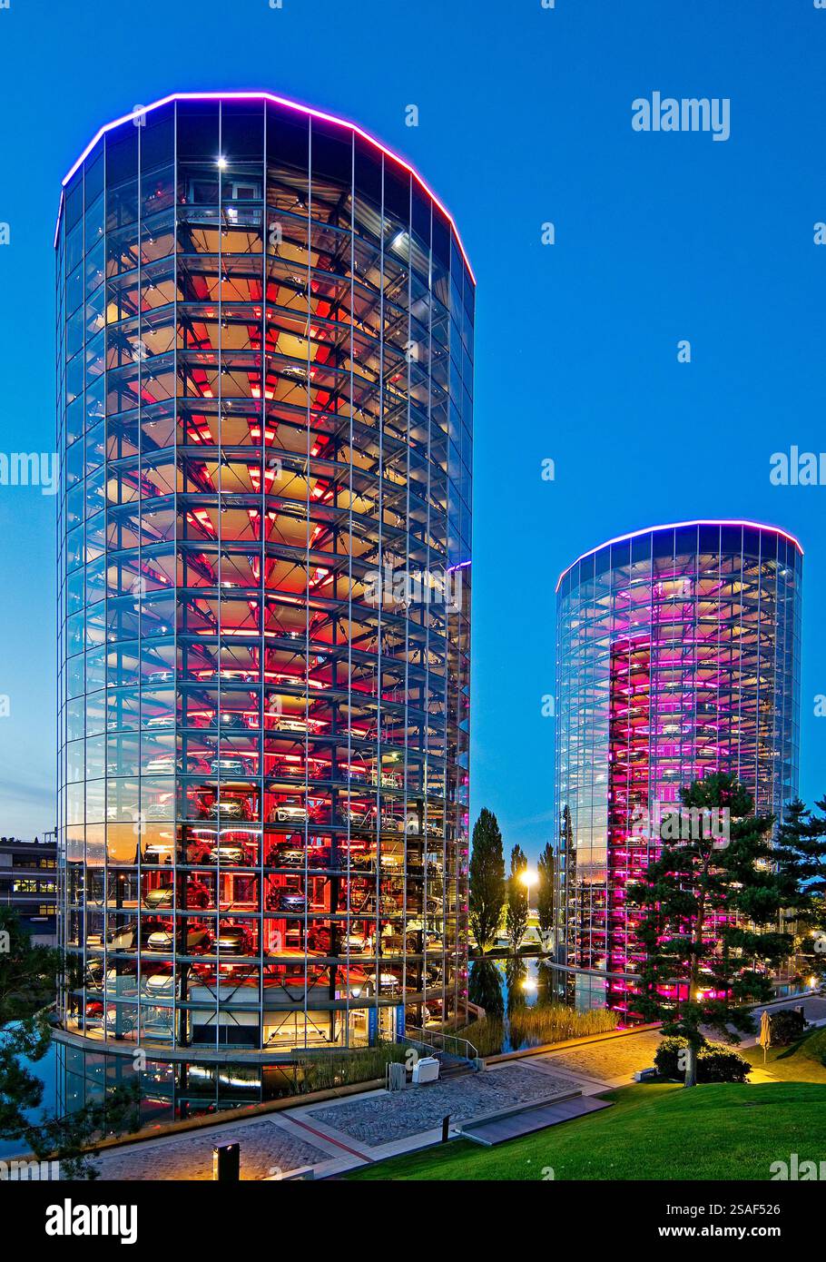 illuminated glass car silos with new cars in the evening, Germany ...