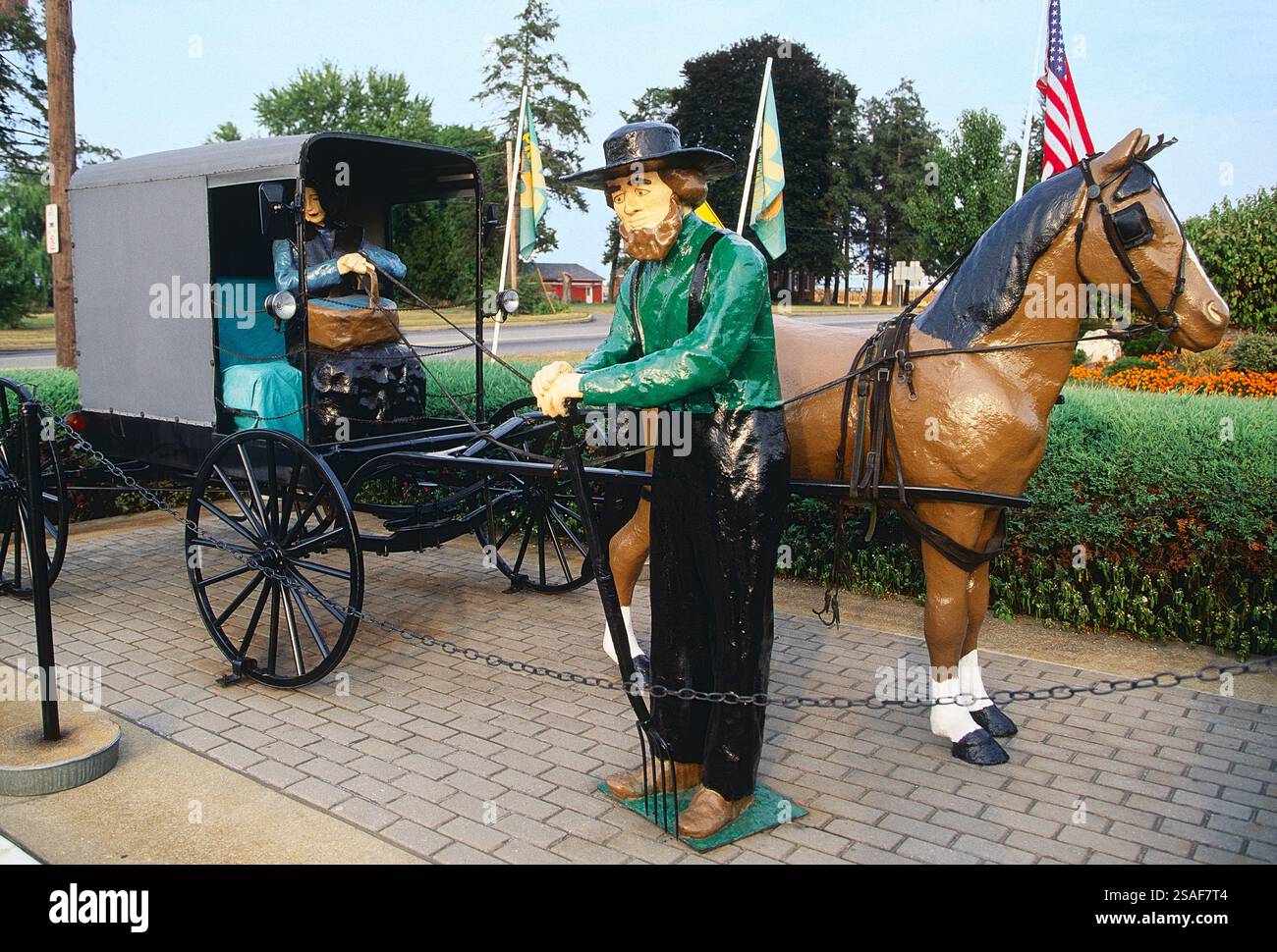 Modern sculpture figures of Amish farmer; horse drawn buggy & Amish ...
