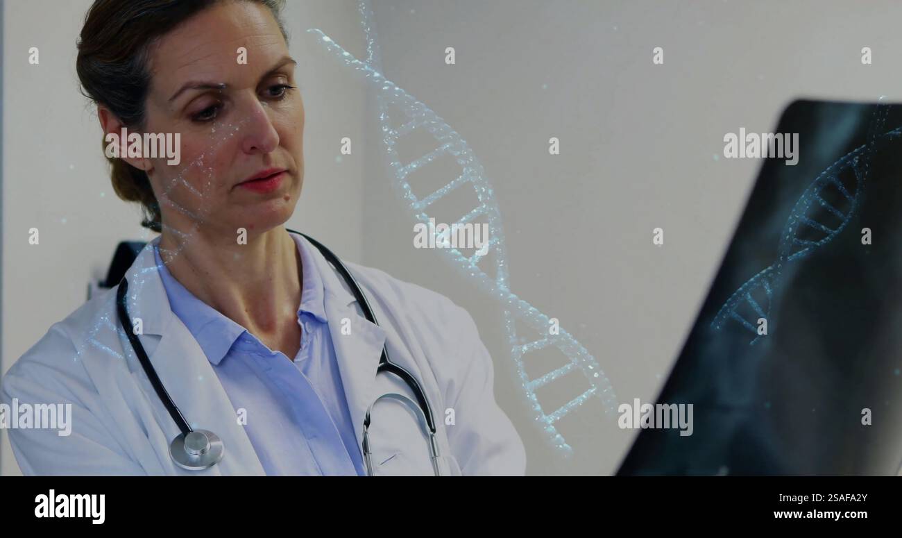 Image of dna strands over caucasian female doctor holding xray Stock ...