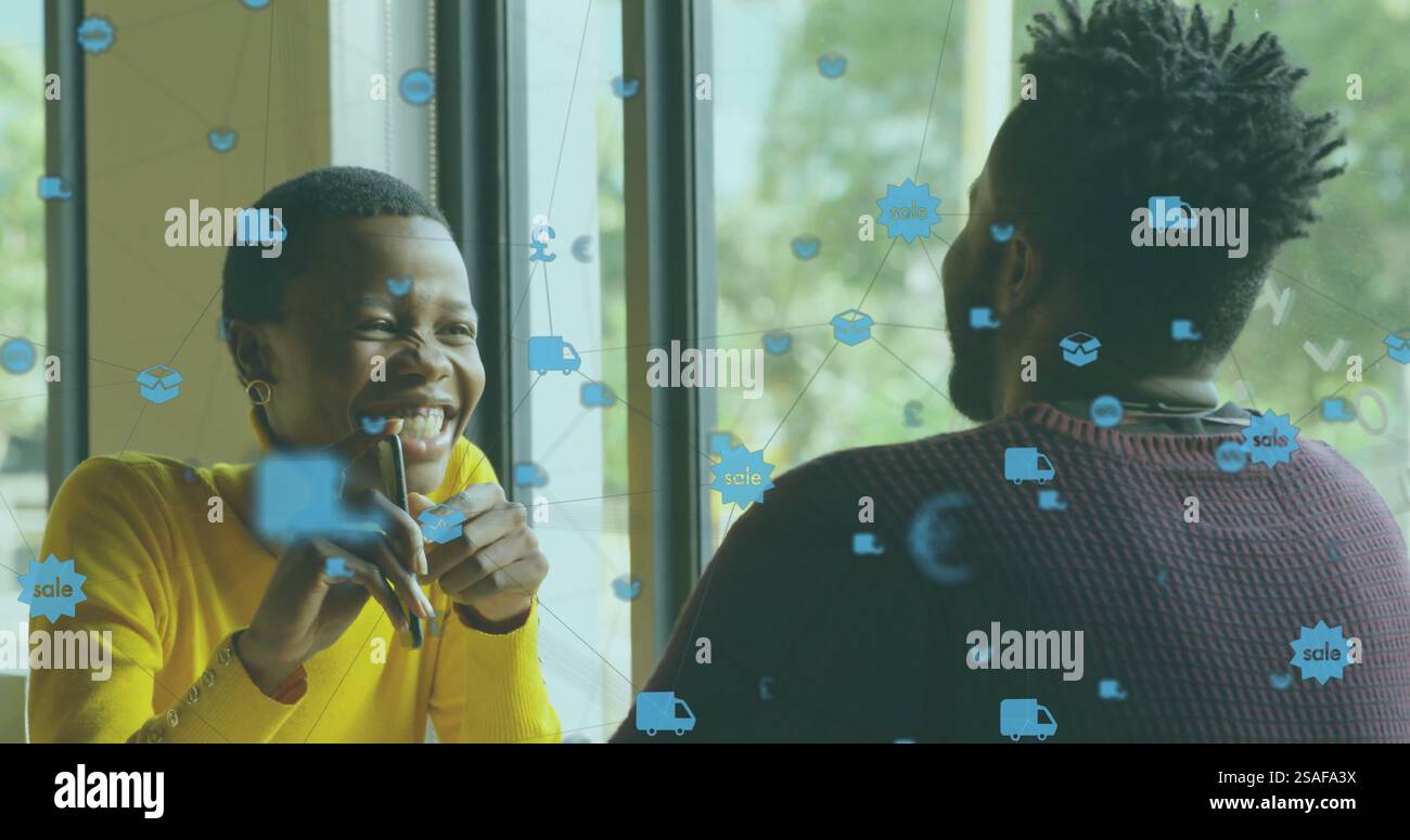 Image of network of connections with icons over african american couple ...