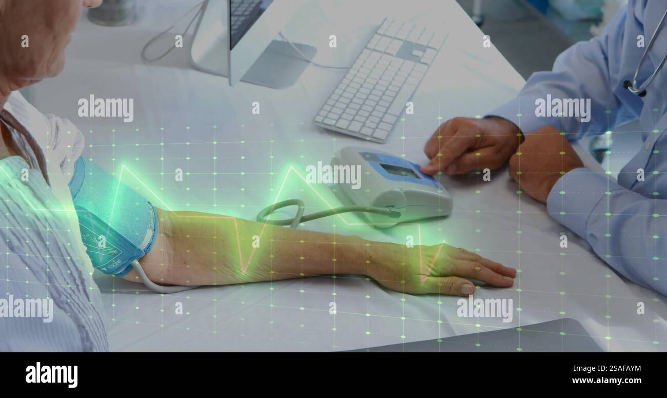 Image of cardiograph over diverse male doctor and female patient in ...