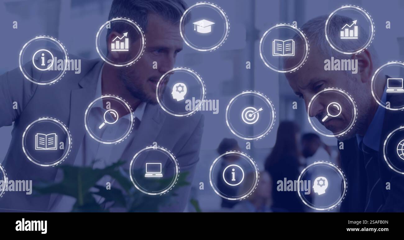 Business icons image over two men discussing in office environment ...