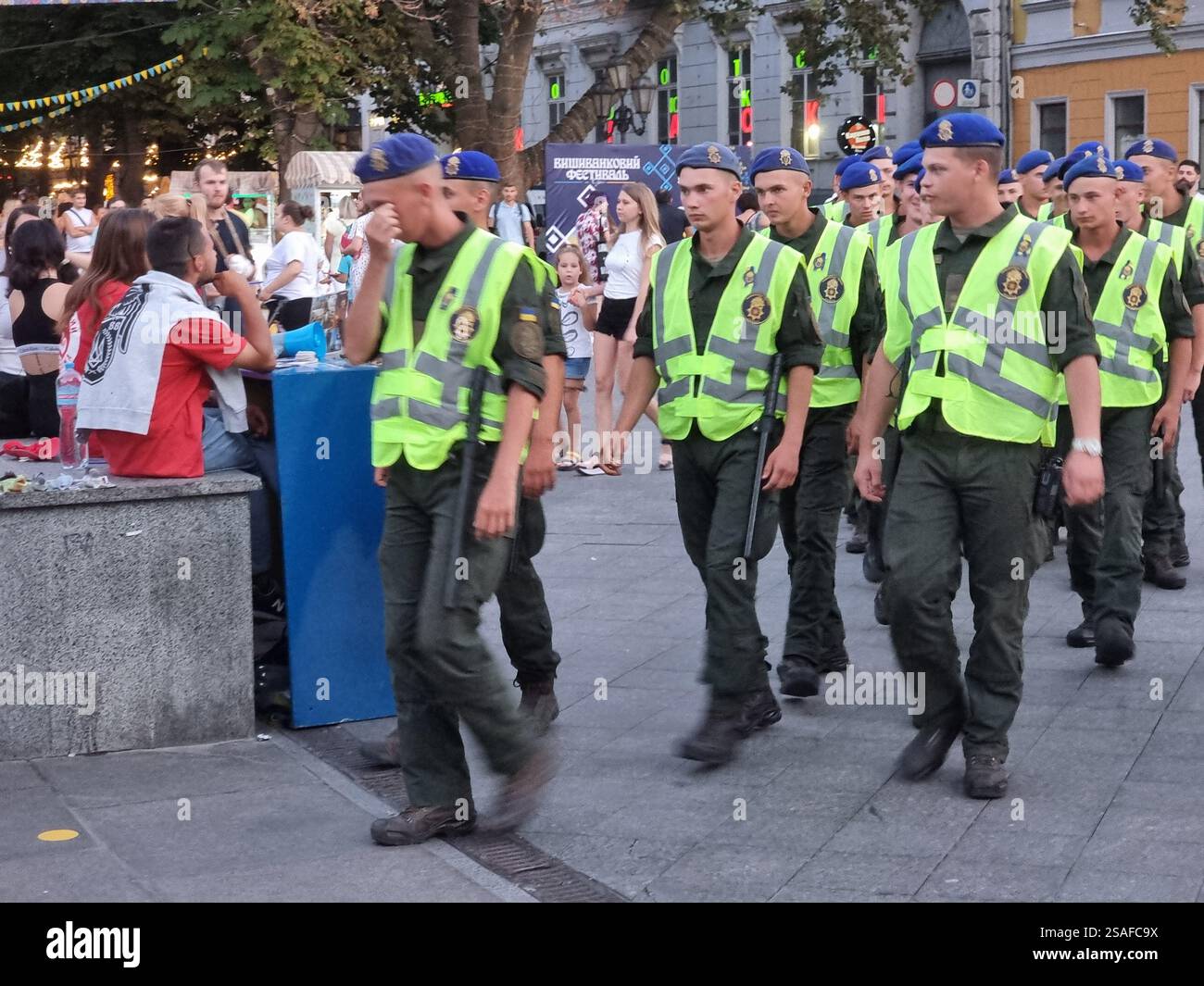Group of Ukrainian National guard with yellow vests and blue berets ...