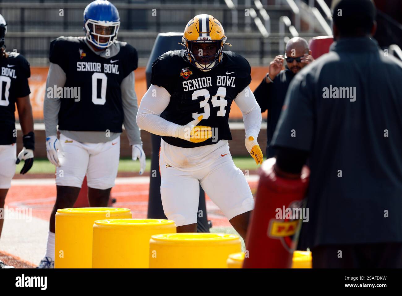 American team defensive lineman Sai'vion Jones of LSU (34) runs through ...