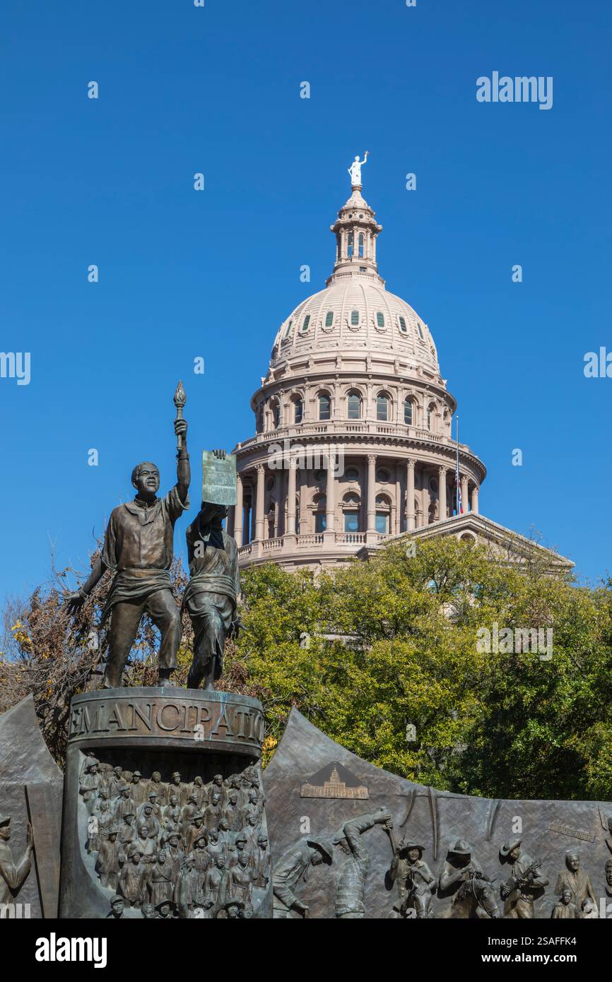 Texas State Capitol dome with a memorial statue in the foreground ...