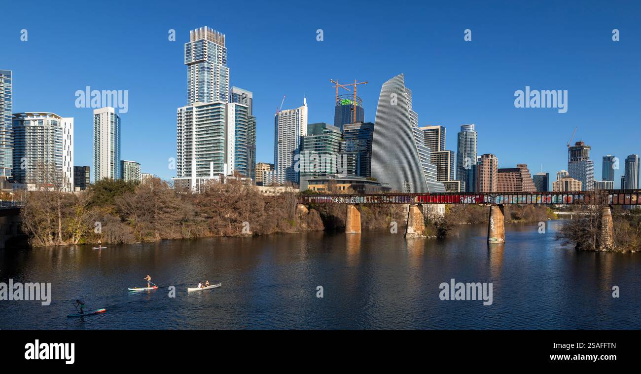 Austin, Texas skyline with modern skyscrapers, a graffiti bridge, and ...