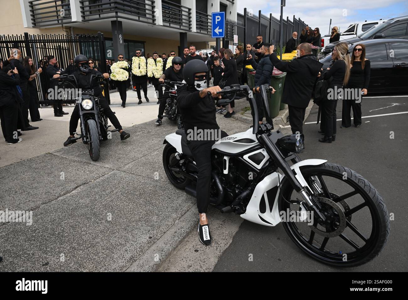 The procession departs following the service for Suleiman “Sam ...