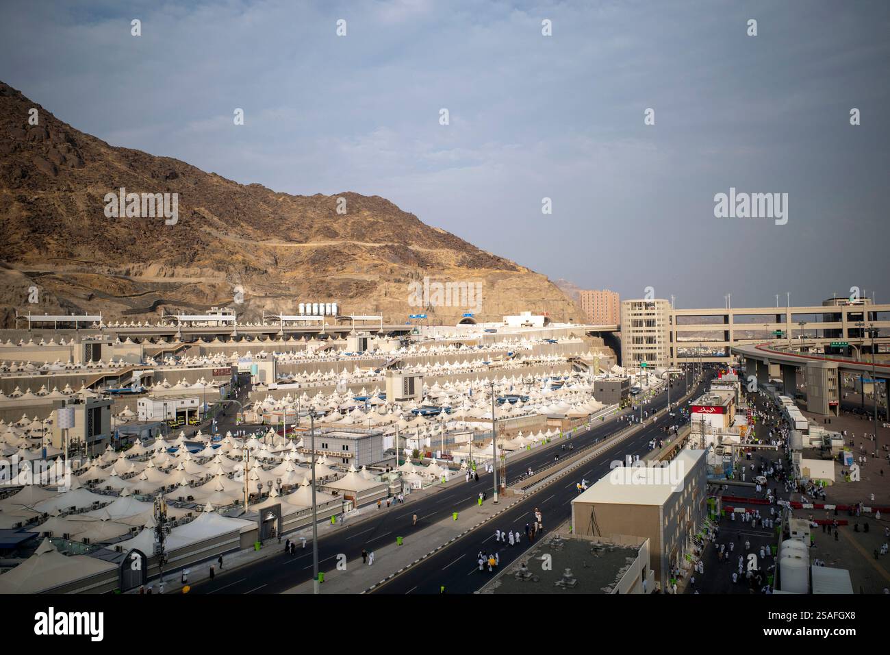 Mecca, Saudi Arabia - June 16, 2024: Buldings and tents for pilgrims during stoning ritual in ...