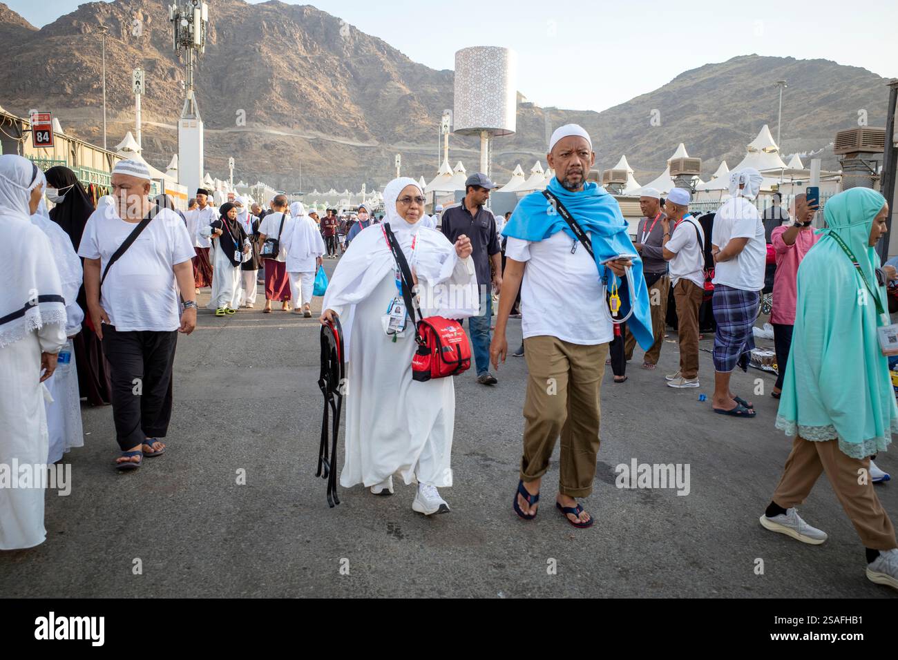 Mecca, Saudi Arabia - June 17, 2024: Pilgrims from Malaysia walking towards the Jamarat stoning ...