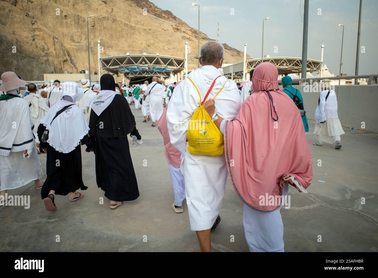 Mecca, Saudi Arabia - June 16, 2024: Pilgrims from Thailand walking towards the Jamarat stoning ...