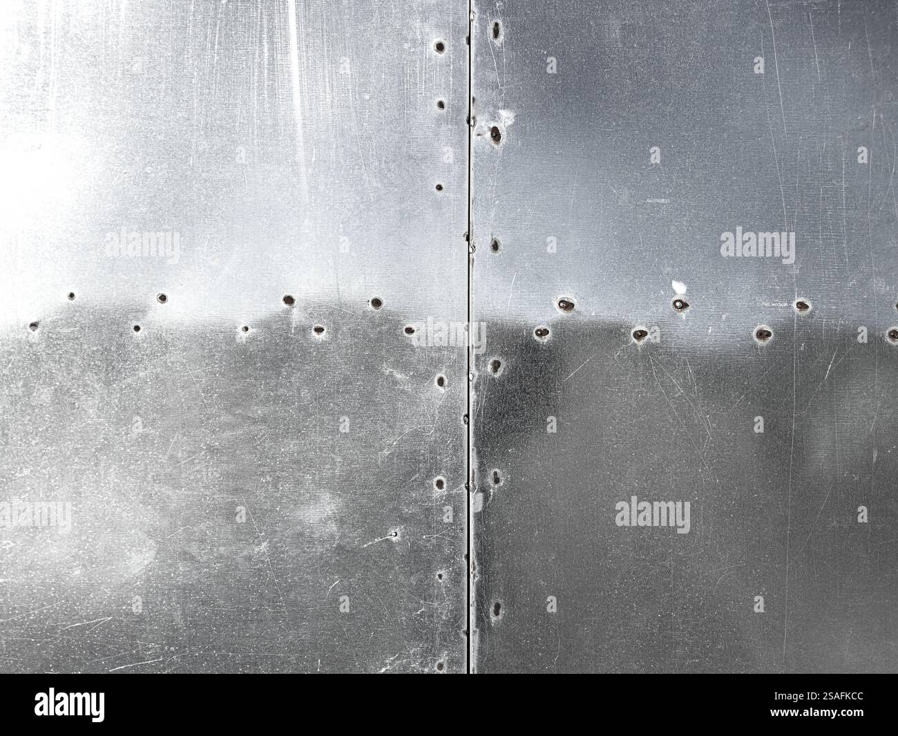 A close-up of a weathered metal wall with rivets Stock Photo - Alamy