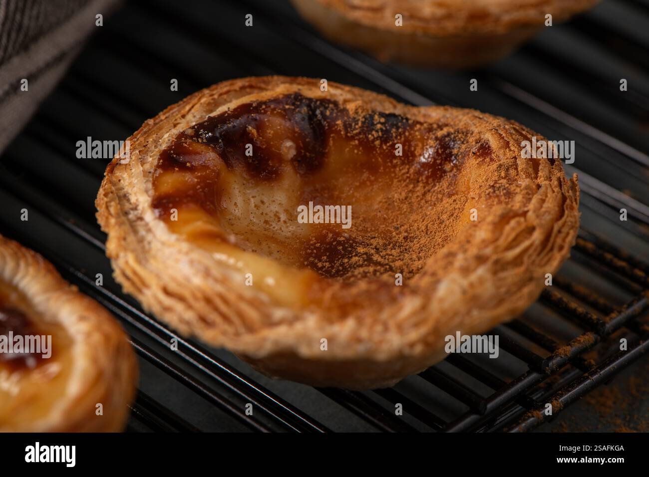 Portuguese custard tart with a flaky, golden-brown crust and a creamy ...