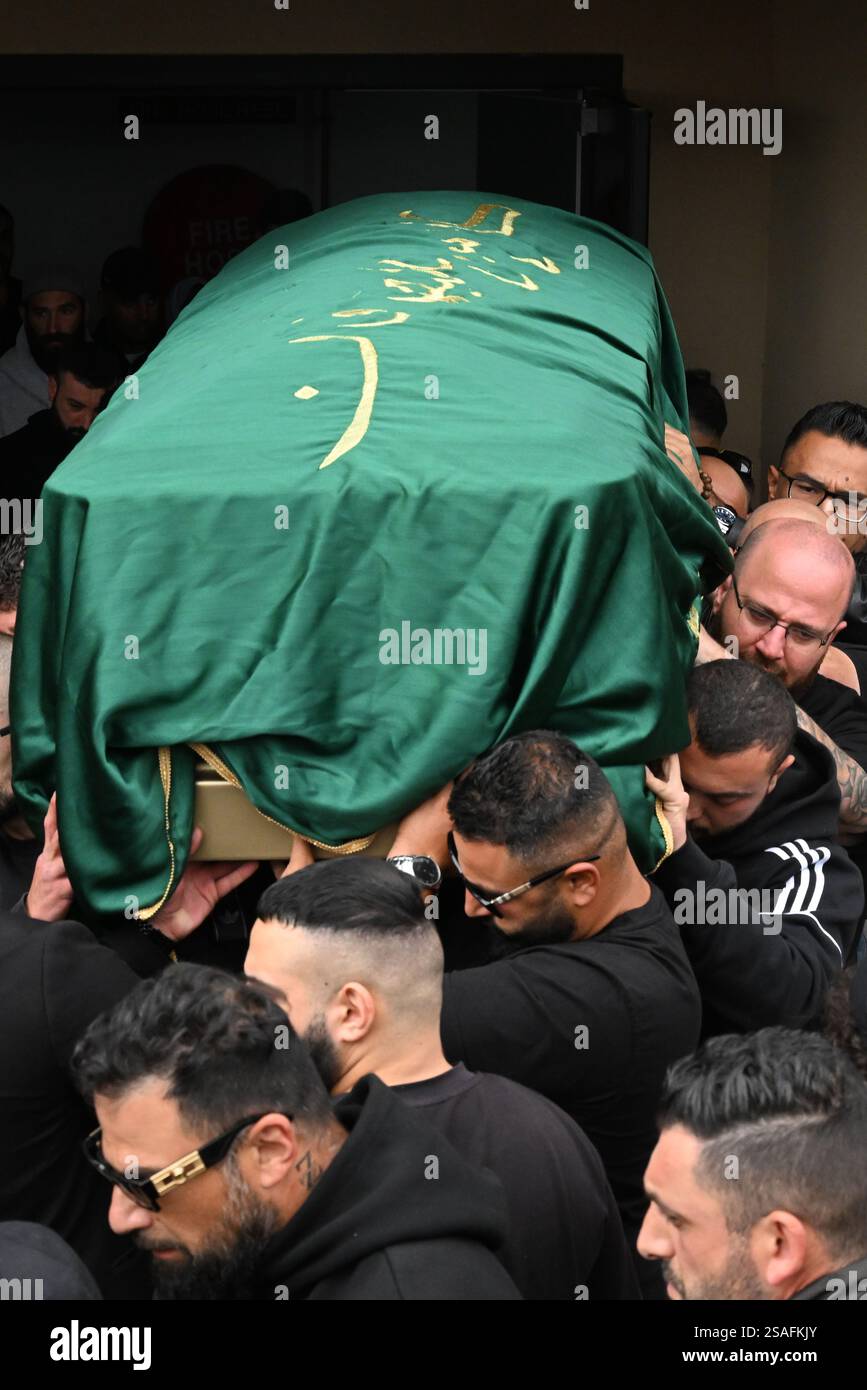 Melbourne, Australia. 30th Jan, 2025. Pallbearers carry the casket to a ...