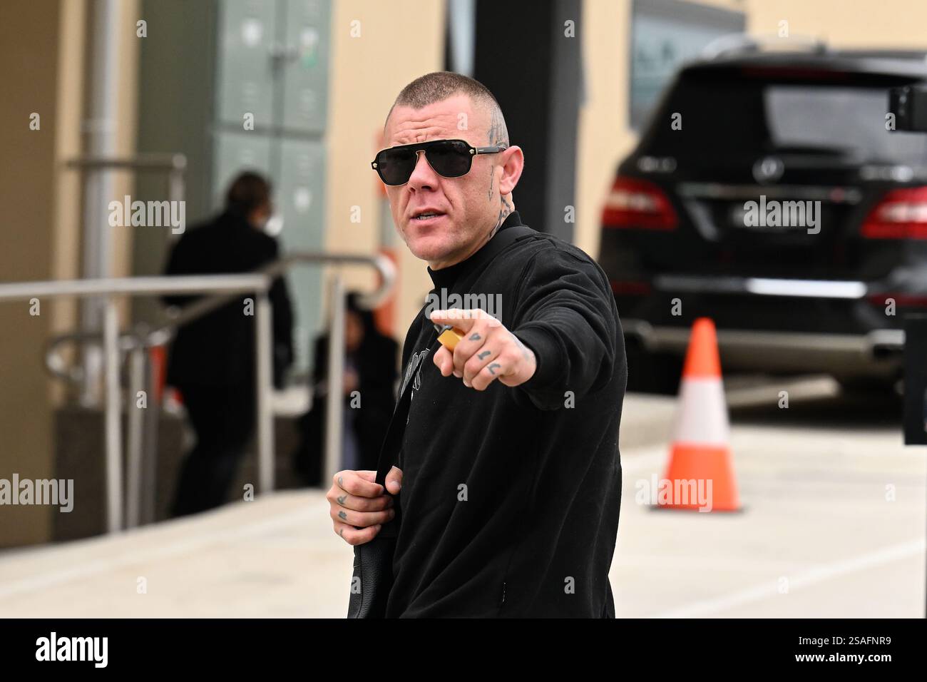 Mourners arrive to the service for Suleiman “Sam” Abdulrahim at the ...