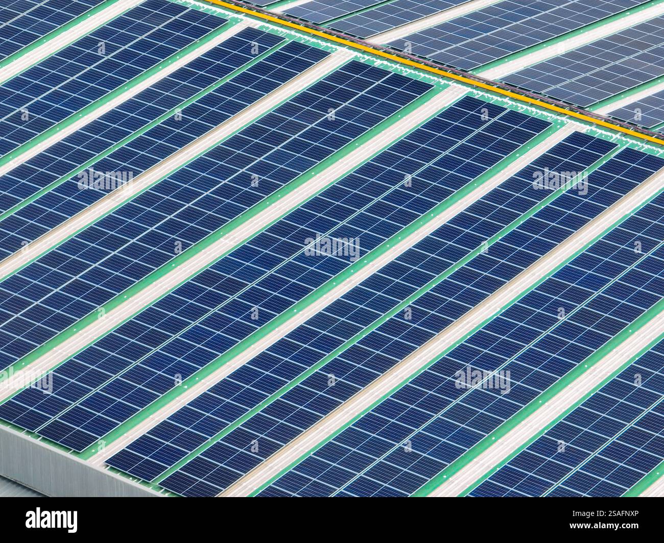 Solar energy for factory and warehouse building. Solar panels on roof ...
