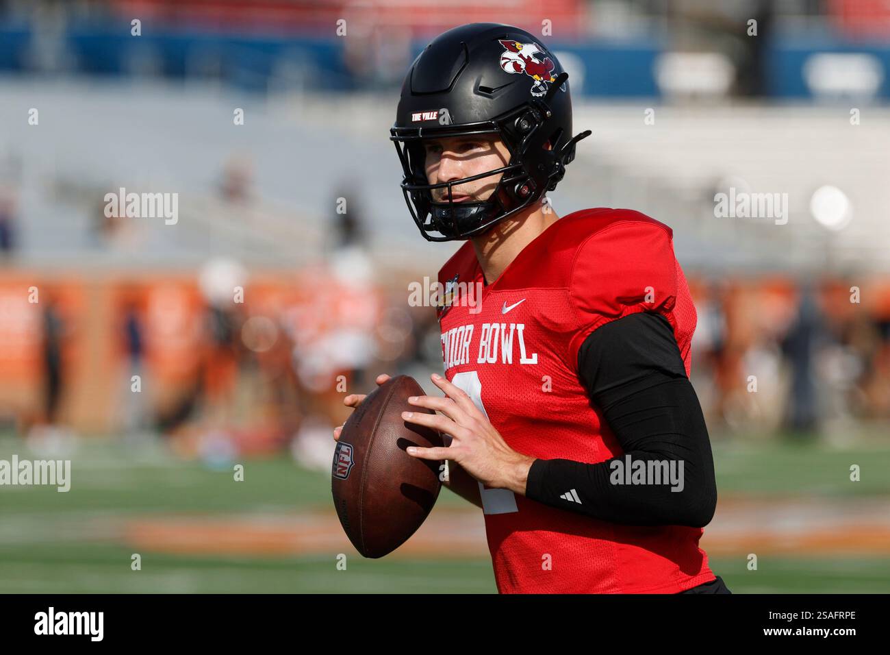 National team quarterback Tyler Shough of Louisville (2) runs through ...