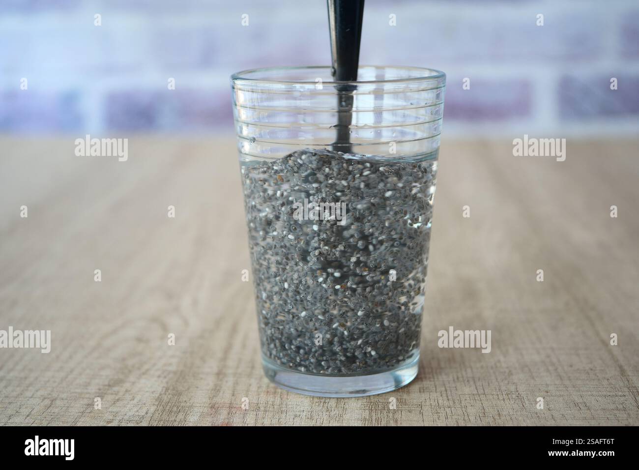 Chia seeds soaking in water Stock Photo - Alamy