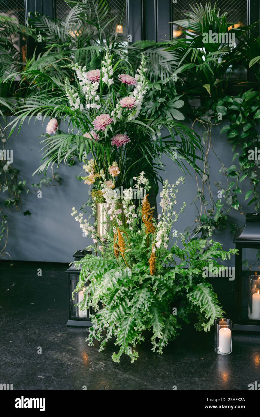 An impressive floral display features vibrant blooms and lush greenery ...