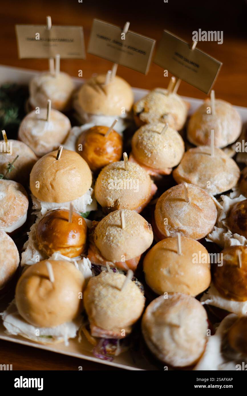 An enticing collection of gourmet sliders is arranged neatly on a ...