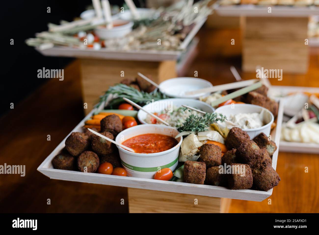 A beautifully arranged buffet table showcases an array of appetizers ...