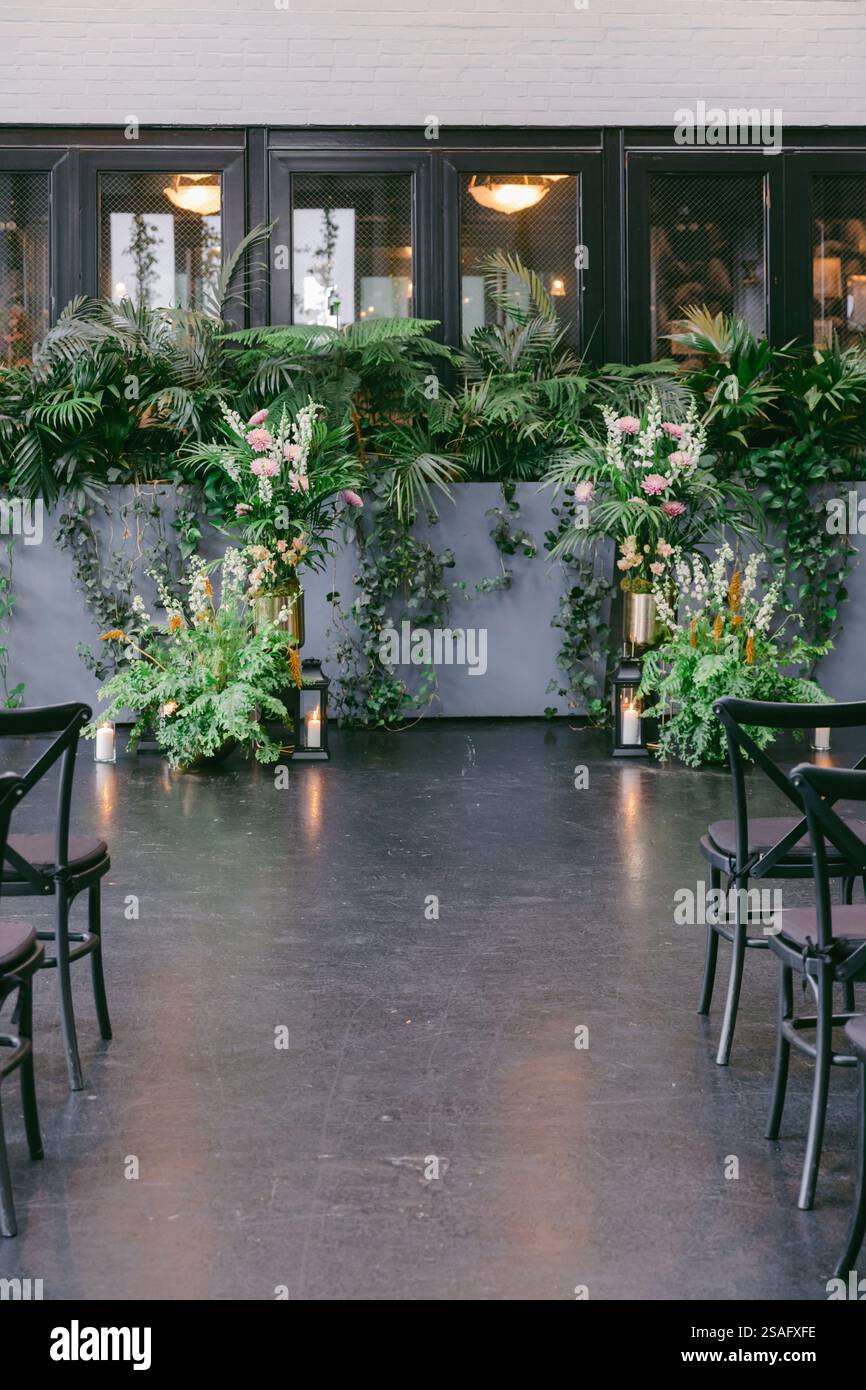 This event space features beautiful floral arrangements and greenery ...