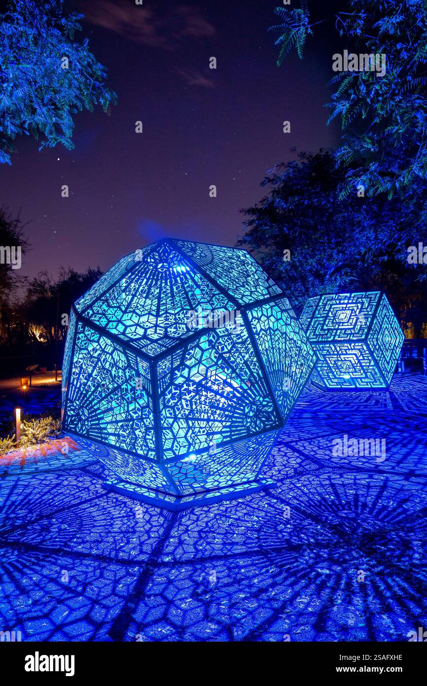 A nighttime view of intricate geometric light sculptures by HYBYCOZO ...