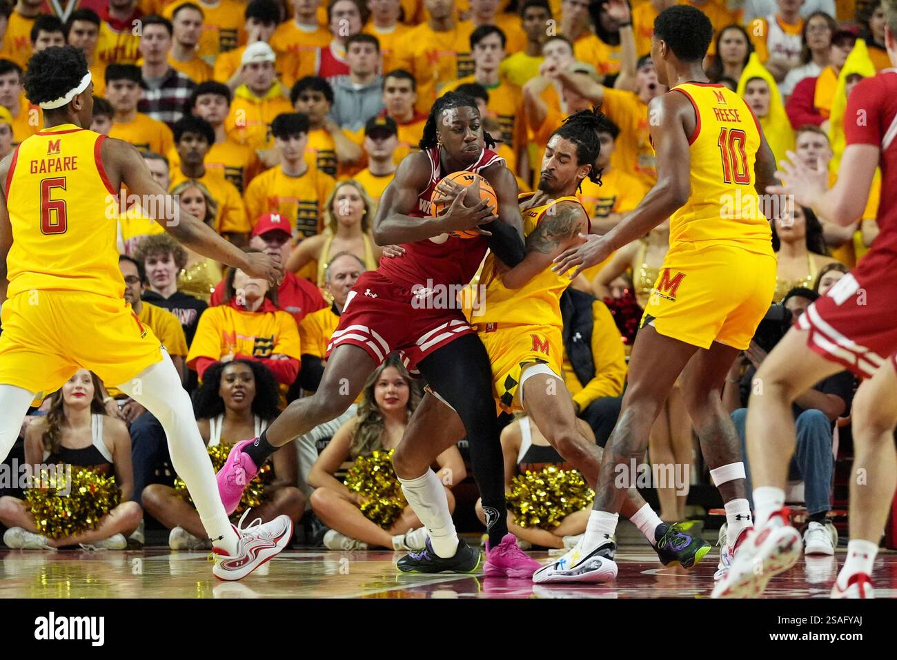 Wisconsin guard John Blackwell pushes past Maryland guard Rodney Rice ...