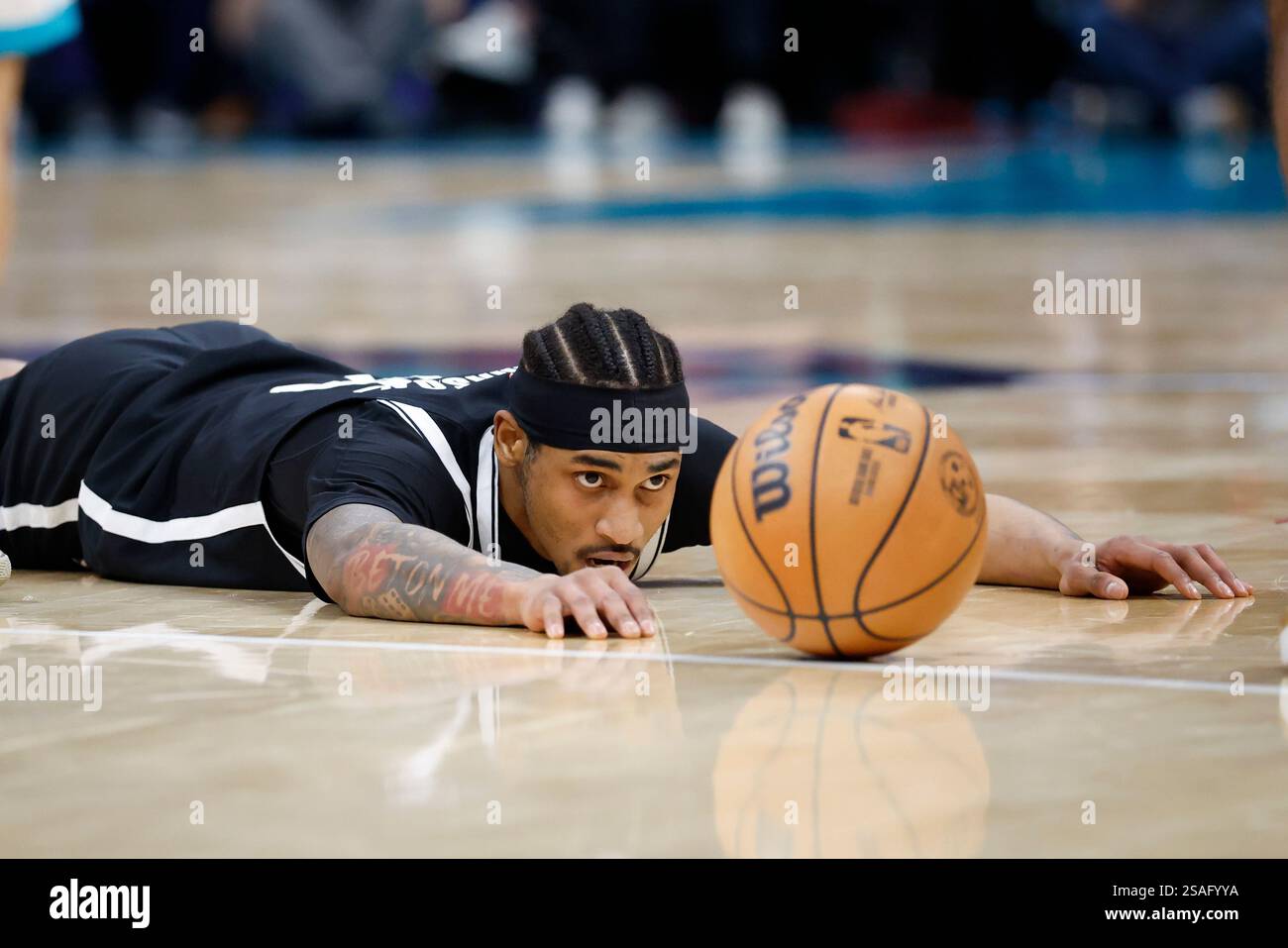 Brooklyn Nets guard Keon Johnson (45) looks at the ball after being ...