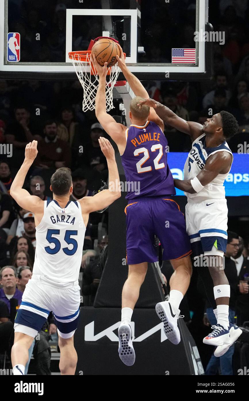 Minnesota Timberwolves guard Anthony Edwards, right, alters a shot by ...