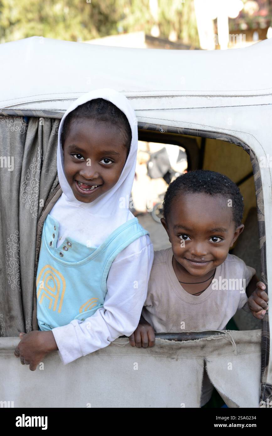 Cute children looking out an Indian Auto Rickshaw in Gondar, Ethiopia ...