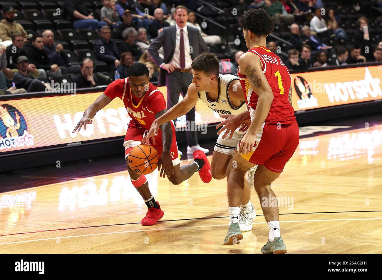 SPARTANBURG, SC - JANUARY 29: VMI Keydets guard AJ Clark (5) steals the ball from Wofford ...