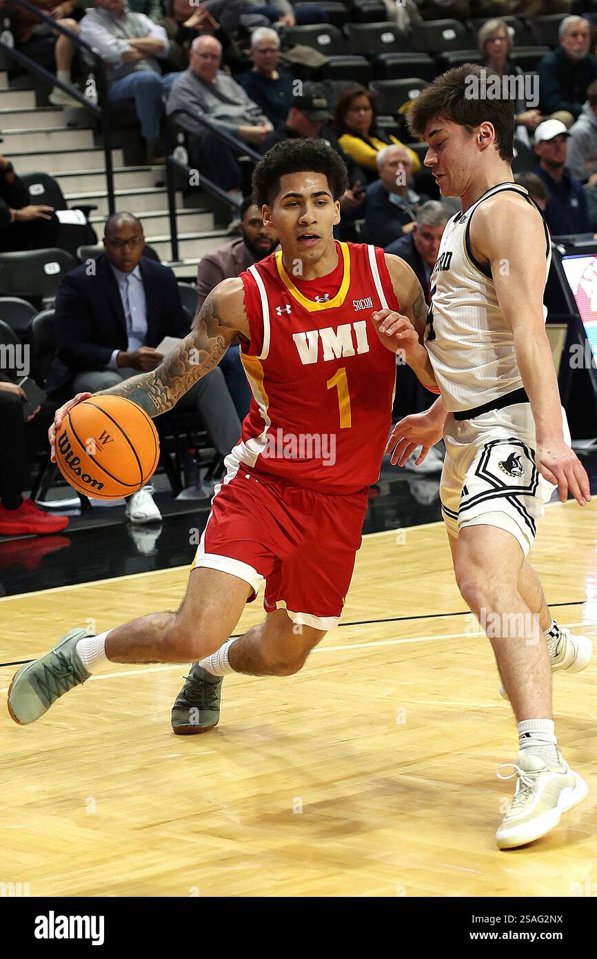SPARTANBURG, SC - JANUARY 29: VMI Keydets guard Rickey Bradley Jr. (1) drives the ball along the ...
