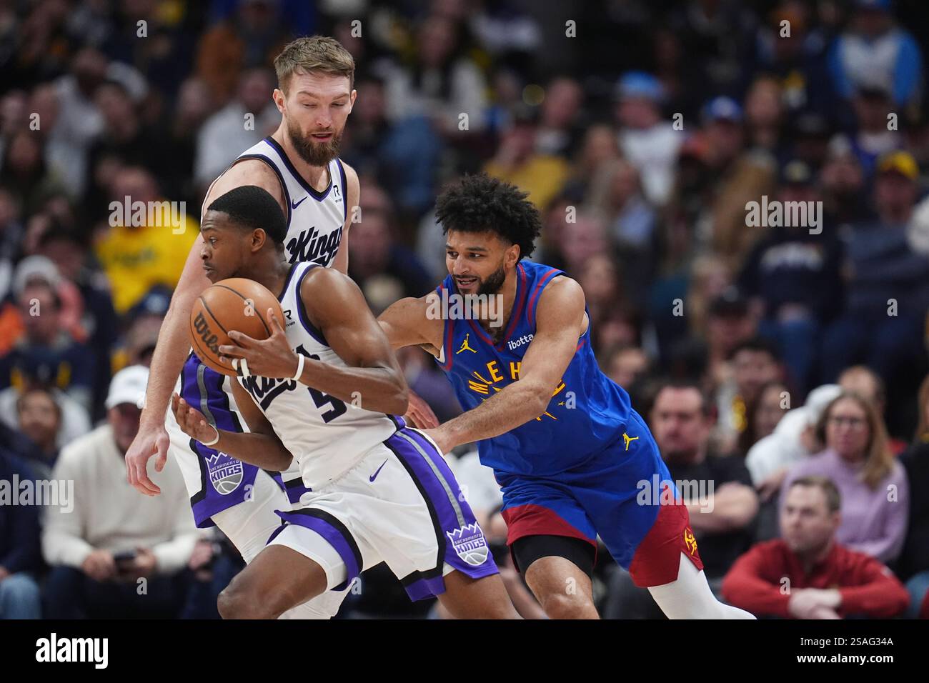Sacramento Kings guard De'Aaron Fox (5) drives past Sacramento Kings forward Domantas Sabonis ...