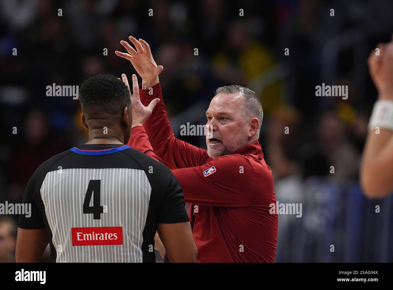 Denver Nuggets head coach Michael Malone () argues for a call with ...