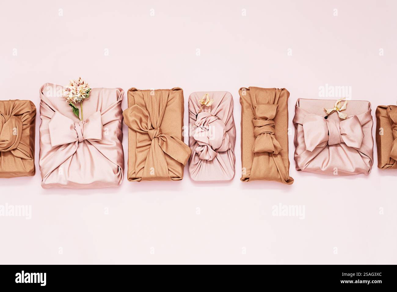 Fabric wrapped gift boxes arranging in a row Stock Photo - Alamy