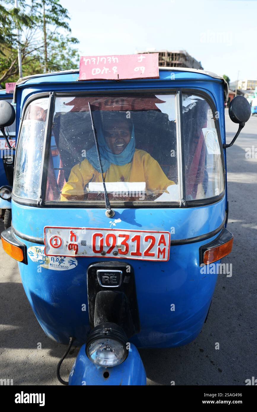 A female Ethiopian driver in her Auto Rickshaw in Kombolcha, Amhara ...