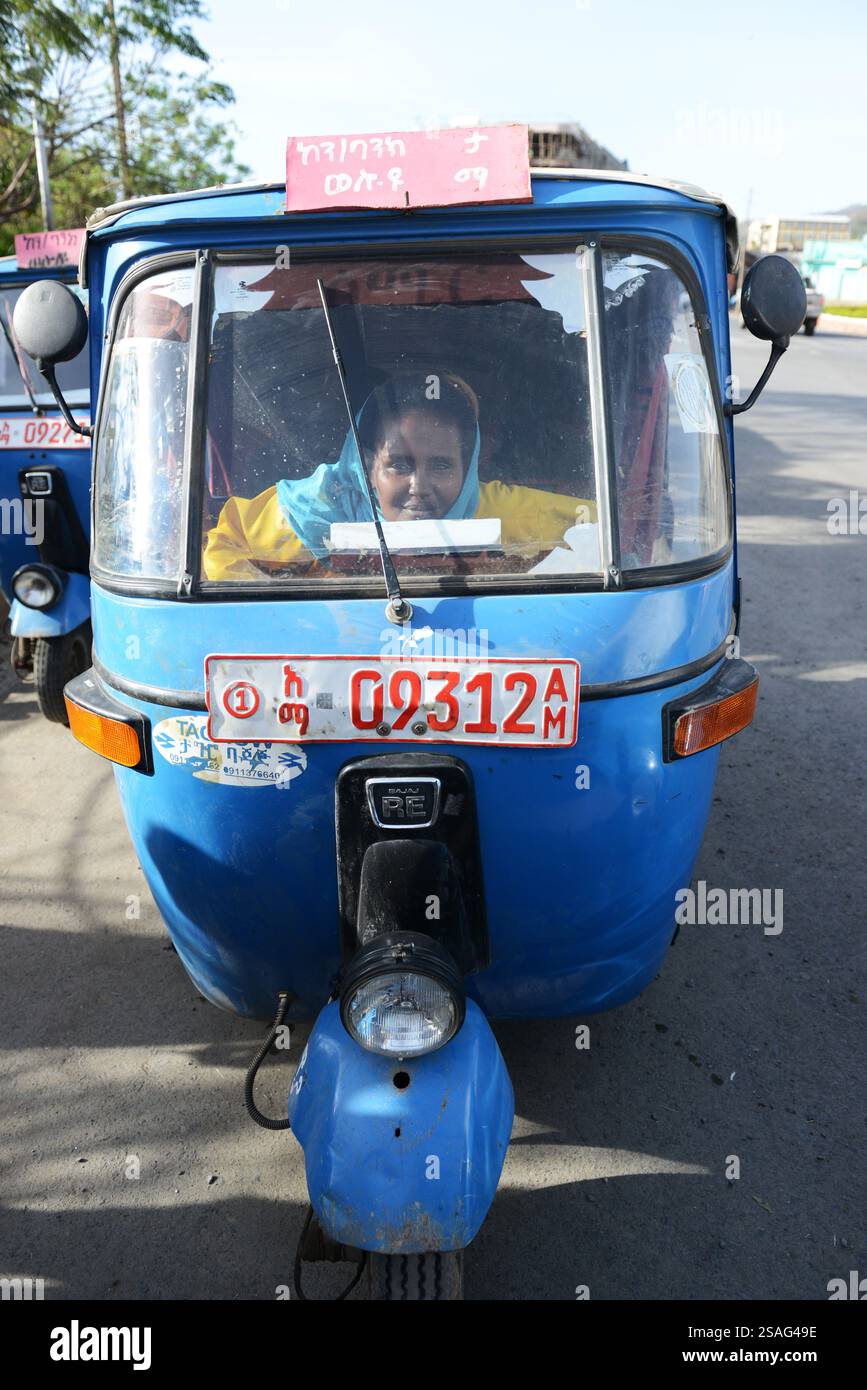 A female Ethiopian driver in her Auto Rickshaw in Kombolcha, Amhara ...