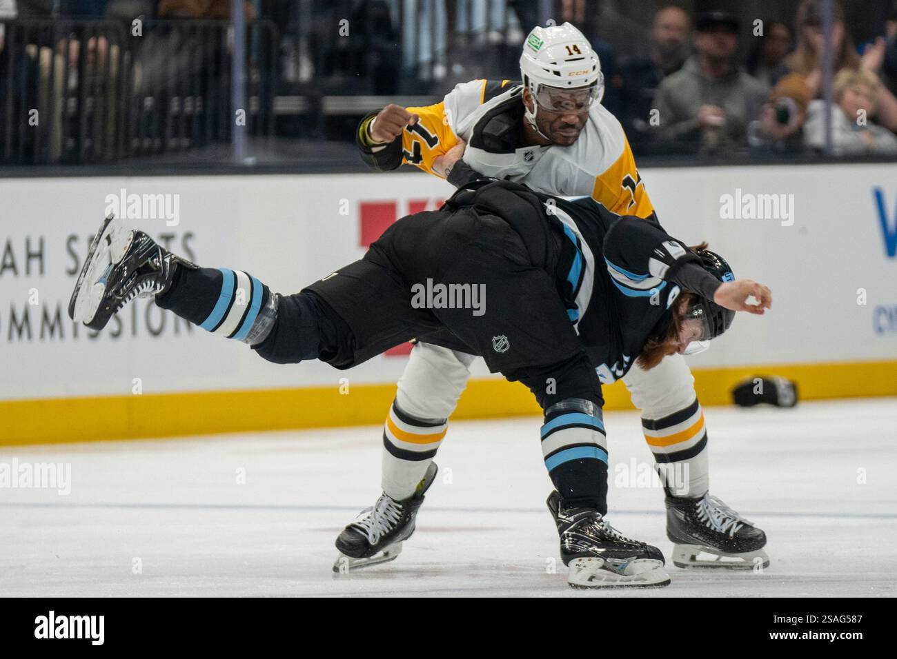 Pittsburgh Penguins left wing Bokondji Imama (top) gets tangled up with ...
