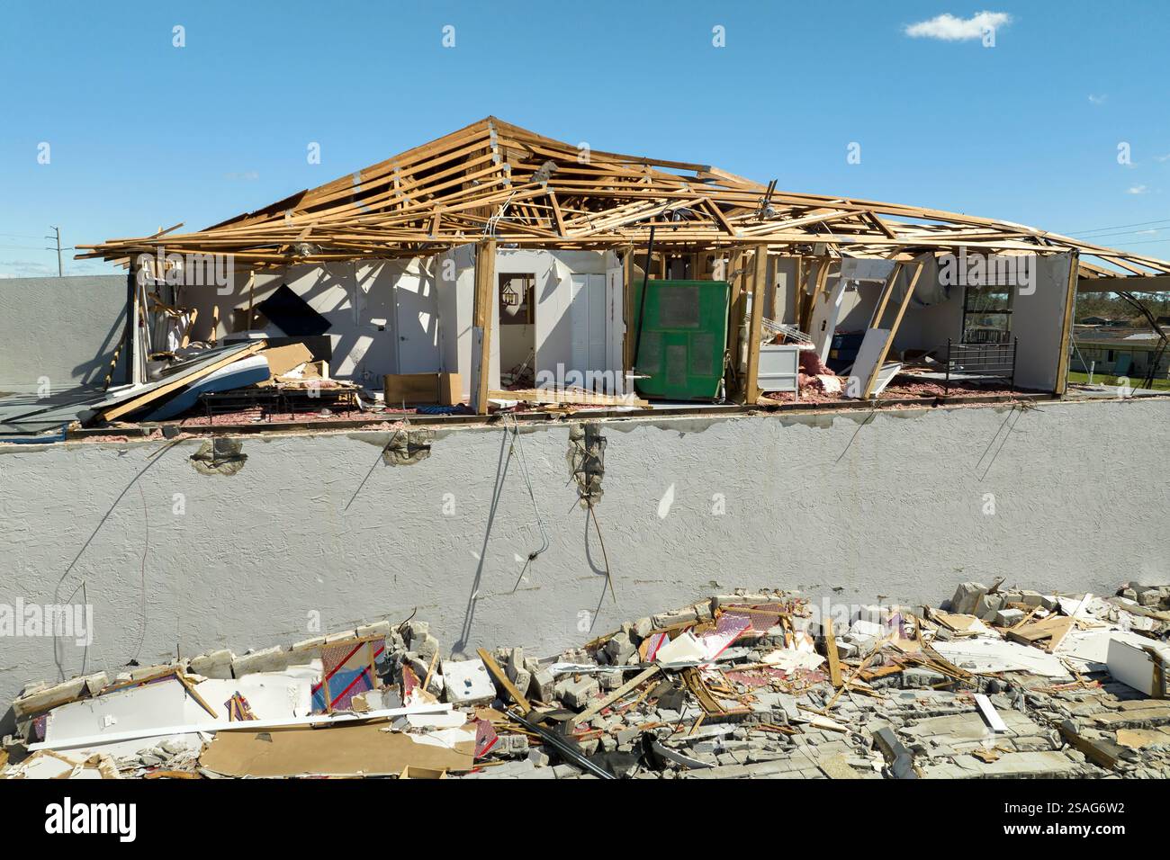 Damaged house roof and walls after hurricane Ian in Florida ...