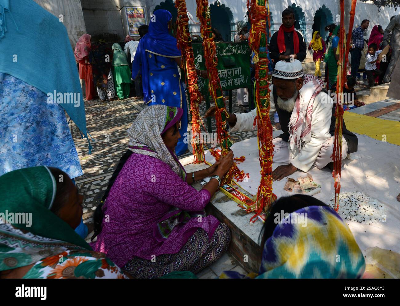 Pilgrims getting a blessing from a Sufi Saint at the Makanpur Mela in ...