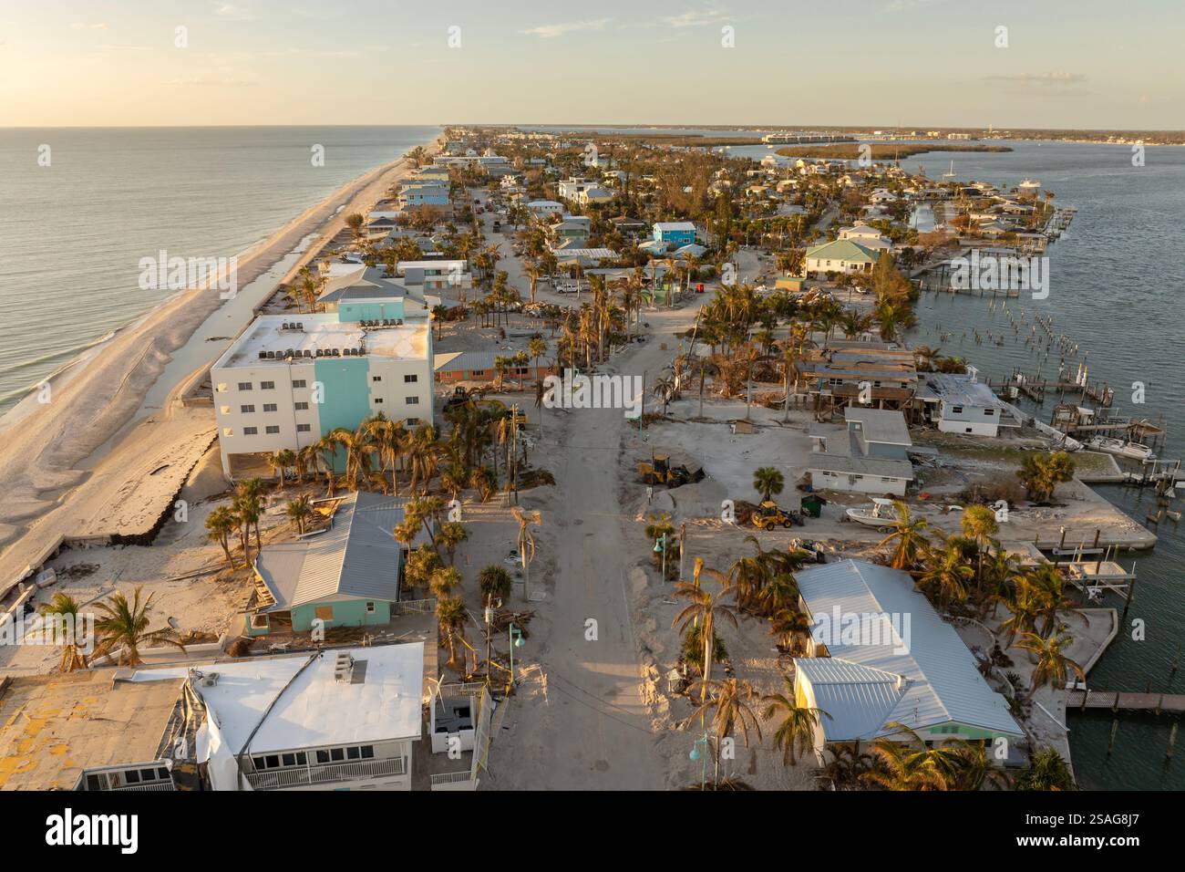Rubbish and scrap disposed in heaps on street side after hurricane ...