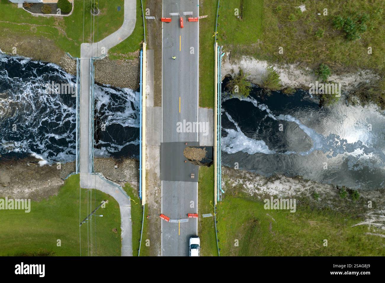Road construction. Repair of destroyed bridge after hurricane flooding ...