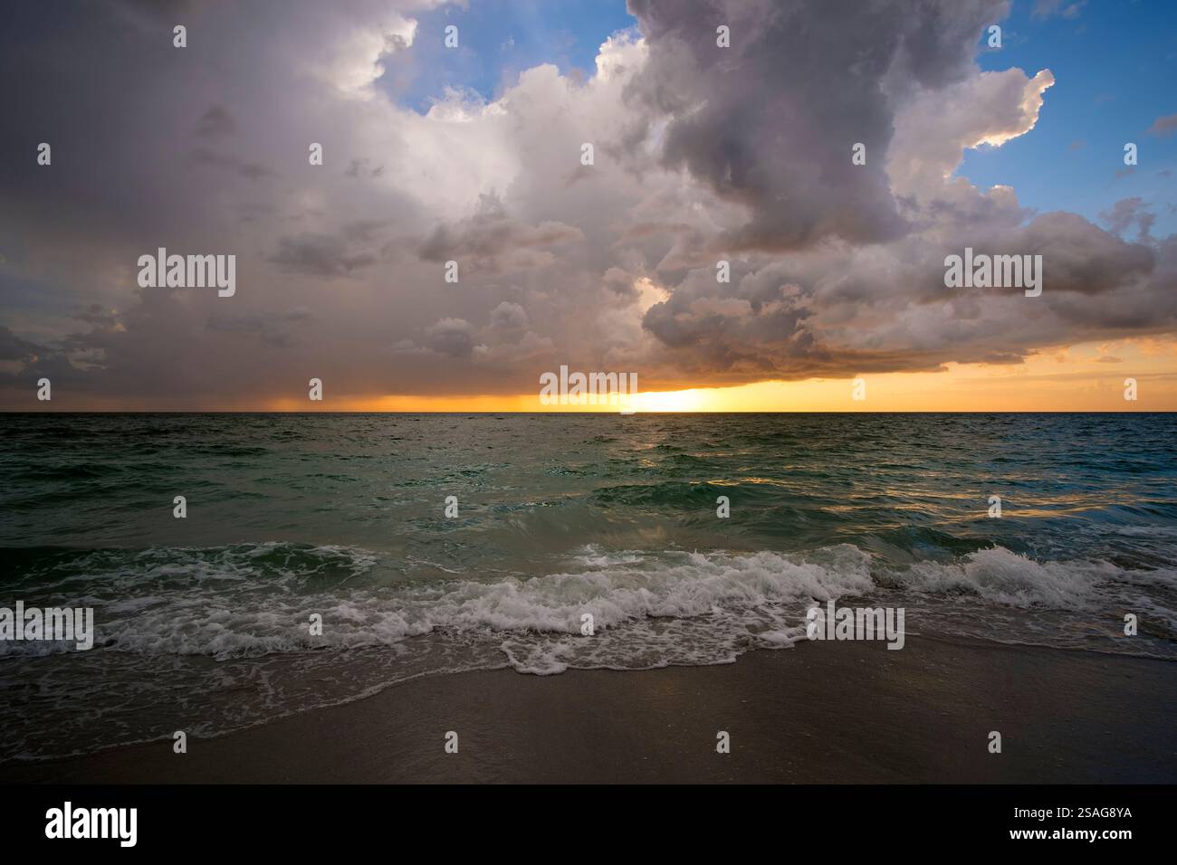 Sunset landscape of rainstorm with lightning and thunder over sea water ...