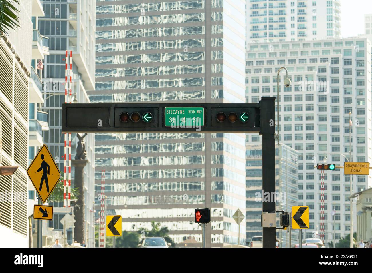 Traffic lights regulating driving cars on city street in Miami, Florida ...