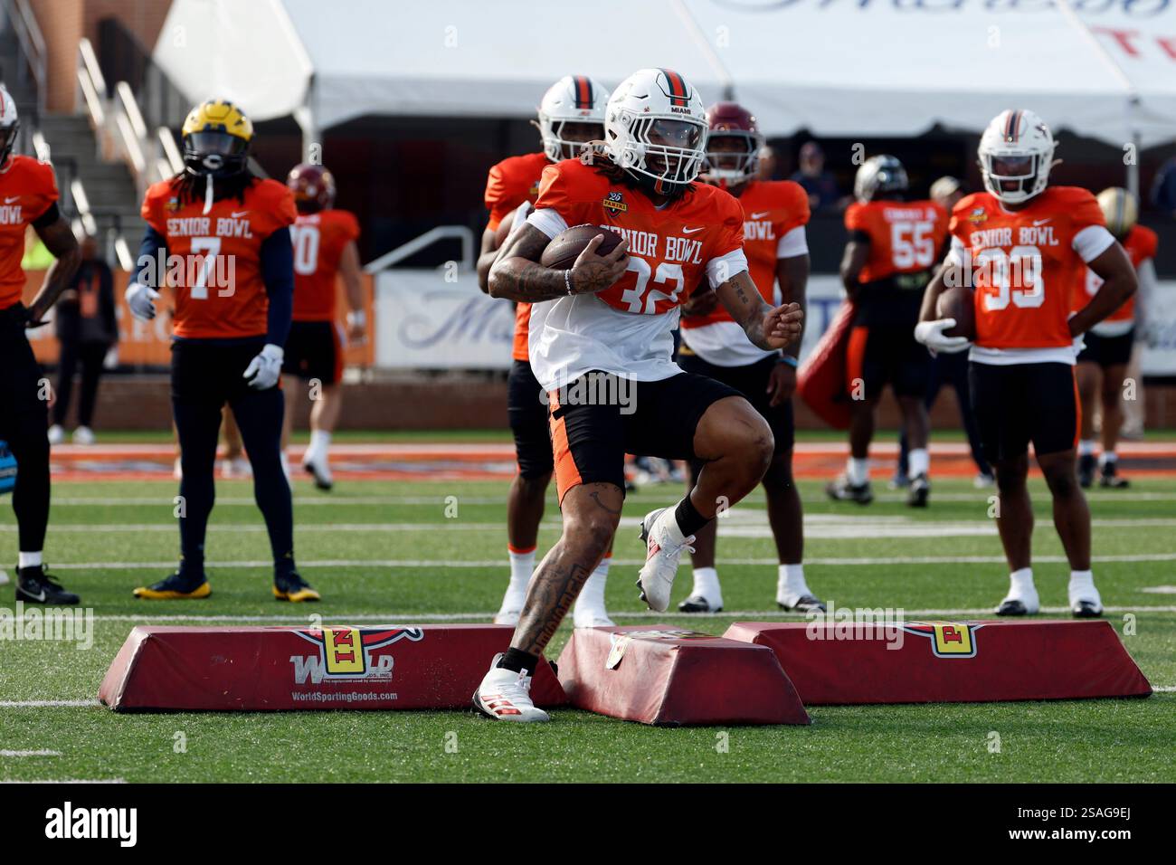 National team running back Damien Martinez of Miami (32) runs through ...