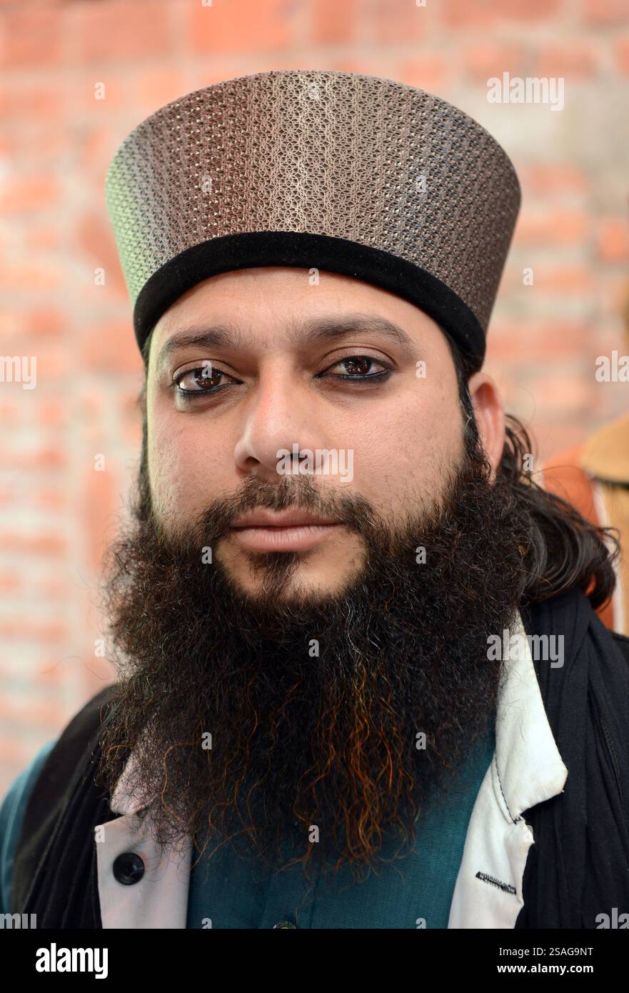 Portrait of a Sufi man taken at the Makanpur Mela in Uttar Pradesh ...